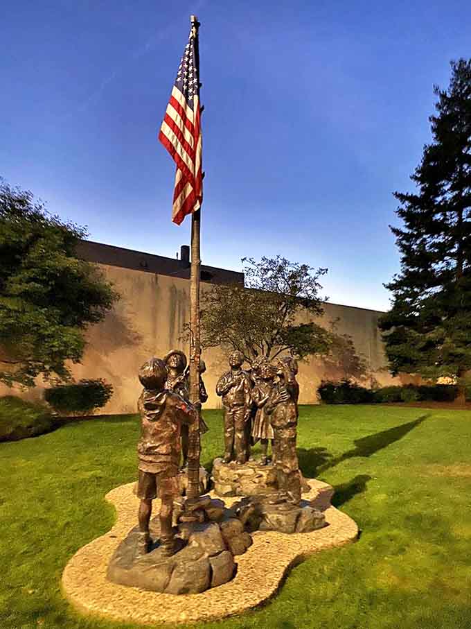 A poignant bronze tribute capturing children raising the American flag &ndash; patriotism cast in metal that somehow feels more genuine than a thousand bumper stickers.