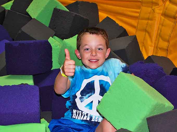 The foam pit: where Olympic-level ambition meets cushiony reality. Your dignity may get lost, but your smile will be found.