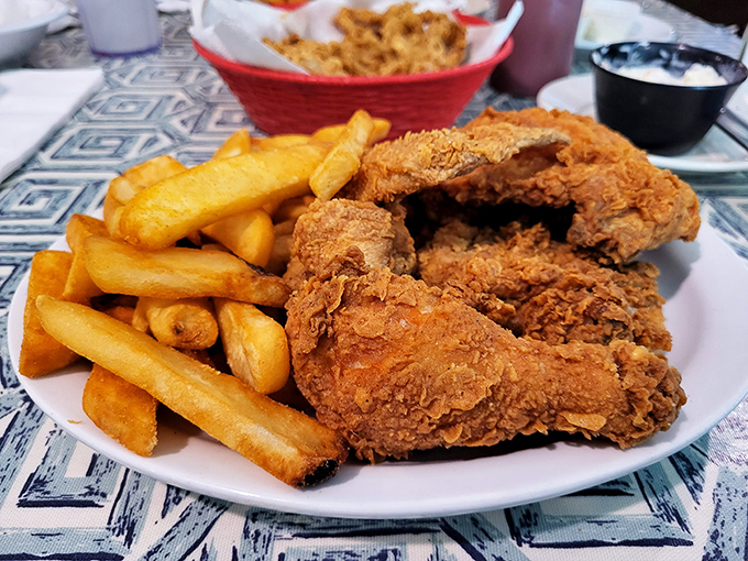 Golden-brown perfection on a plate &ndash; Gil's legendary fried chicken with fries might just ruin all other fried chicken for you forever.