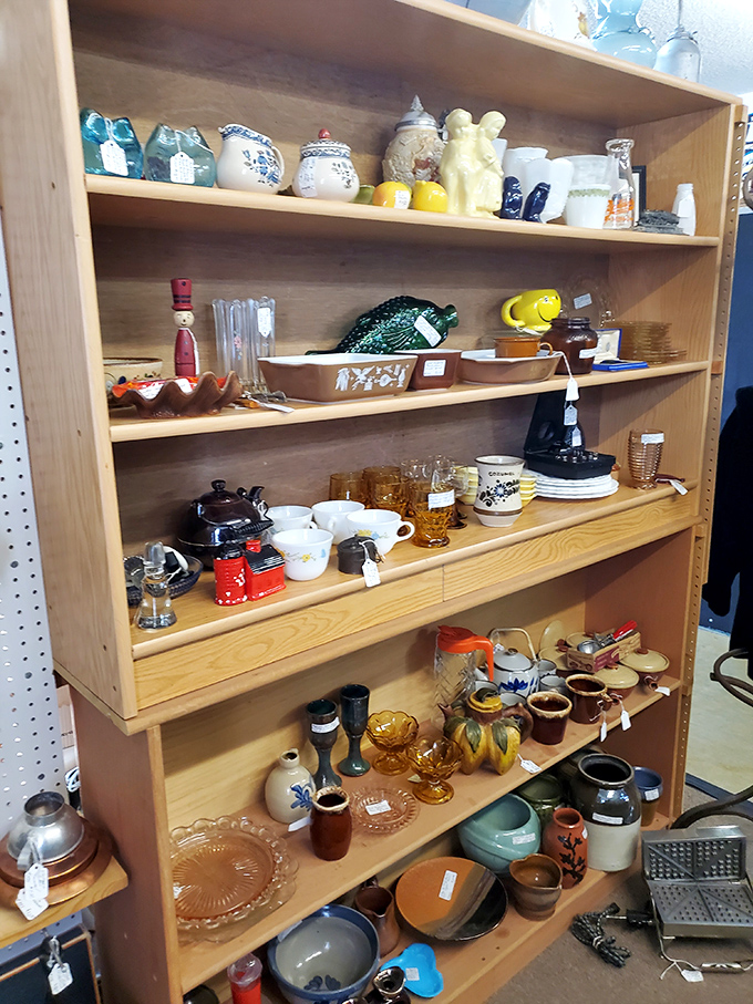 Delicate ceramics and collectibles line these shelves, each piece waiting to tell its story to the right person who stops to listen.