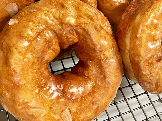 These aren't just donuts &ndash; they're edible monuments to the art of pastry. Golden-brown perfection with a glaze that catches the light like morning dew.