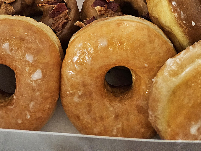 These glazed donuts aren't just breakfast, they're an experience &ndash; light, airy clouds with that perfect sugar shell that shatters delicately with each bite.