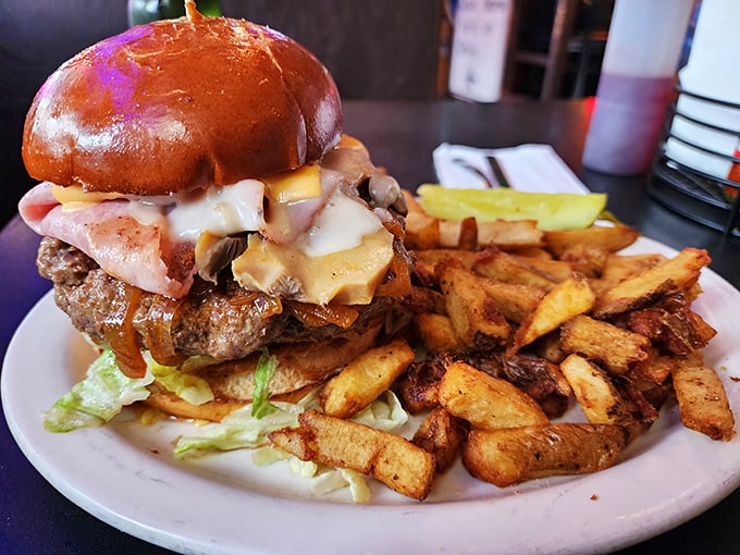 Behold the burger that launched a thousand food challenges! Stacked high with toppings and requiring both hands (and maybe a fork).