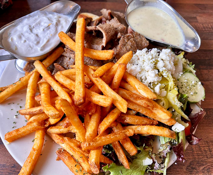 This isn't just a gyro platter – it's a Mediterranean vacation on a plate, complete with crispy fries and tangy tzatziki.