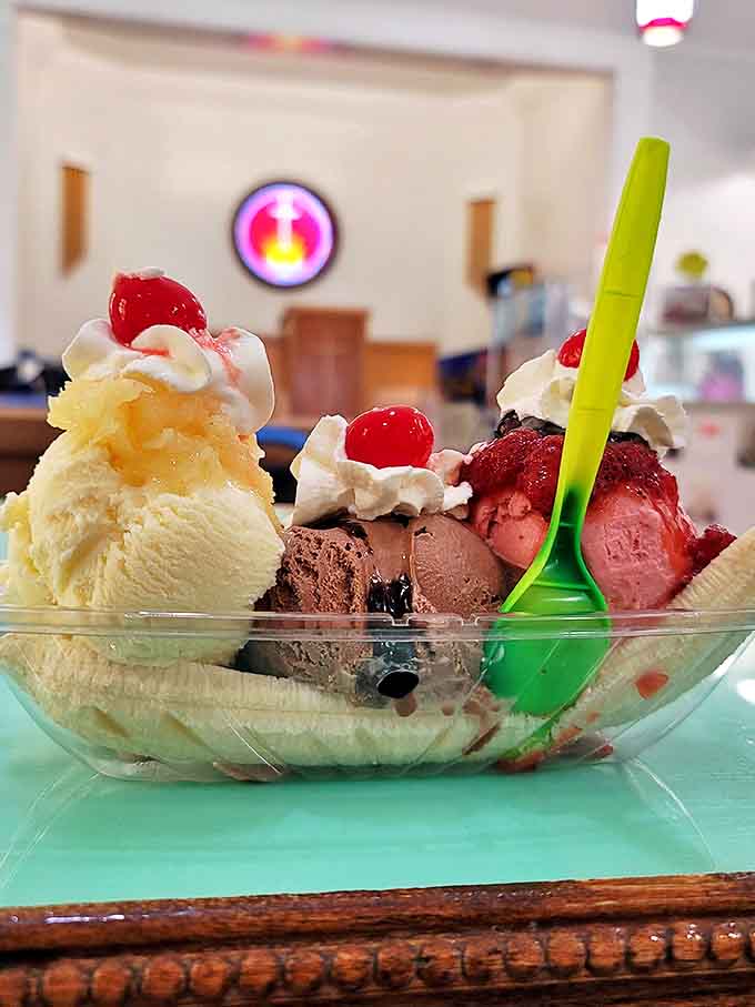 The holy trinity of ice cream &ndash; chocolate, vanilla, and strawberry &ndash; nestled alongside banana with all the heavenly trimmings. Salvation in a dish!