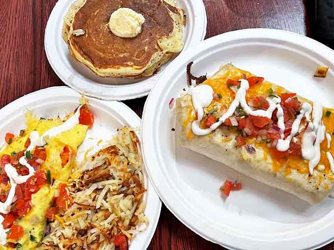 Behold the breakfast spread that launched a thousand satisfied sighs, featuring pancakes, omelets, and hash browns in perfect harmony.