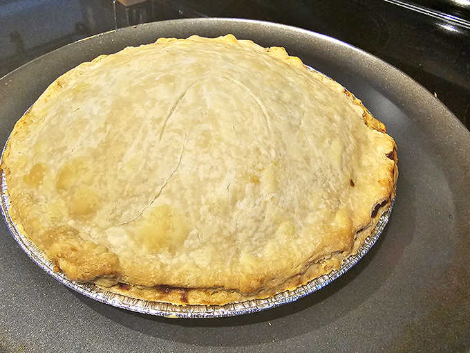 Golden, flaky crust cradles fruit filling so fresh you'd swear it was picked this morning. This isn't just pie, it's edible poetry.