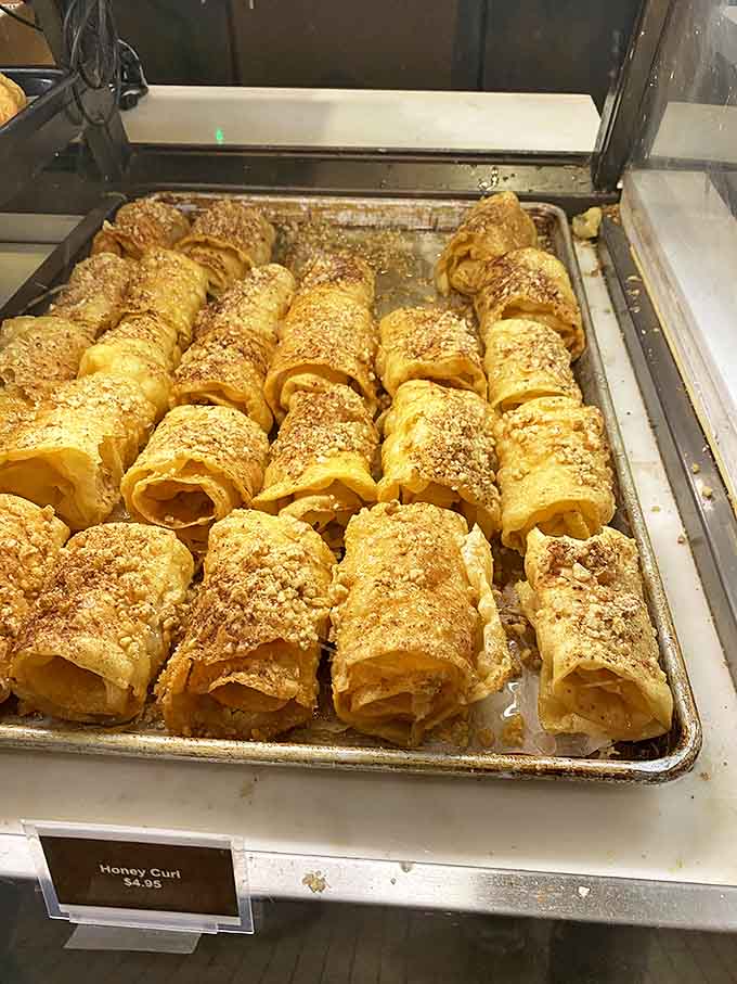 Honey curls that shatter at first bite, revealing buttery layers within &ndash; like phyllo dough decided to reinvent itself as a cinnamon-dusted magic wand.