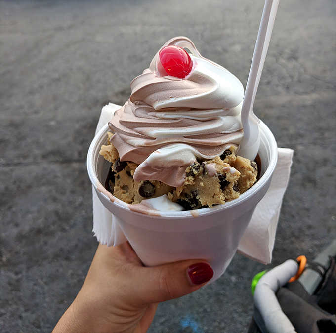 Cookie dough ice cream crowned with a perfect swirl of soft-serve and topped with a cherry &ndash; architecture you can eat.