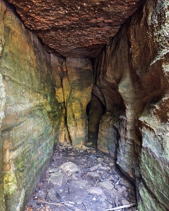 Narrow passageways between towering rock walls create natural corridors that feel like passages to hidden worlds.