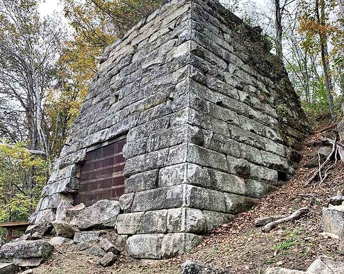 The massive stone Hope Furnace stands as a silent sentinel to Ohio's industrial past, where iron once flowed like water through these woods.