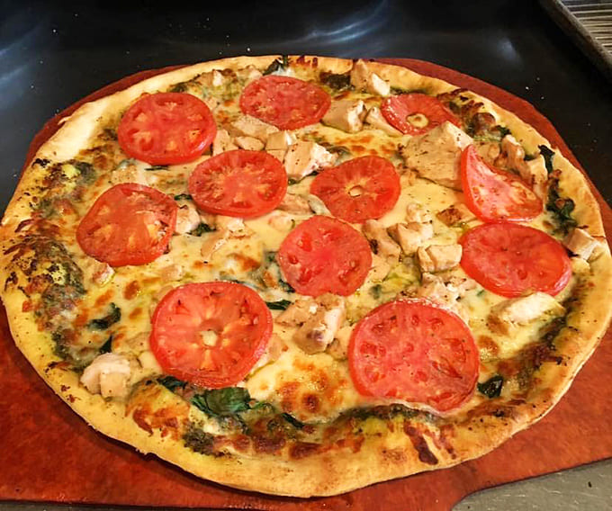 This chicken pesto pizza proves that sometimes the best combinations are the ones you didn't know you needed desperately.