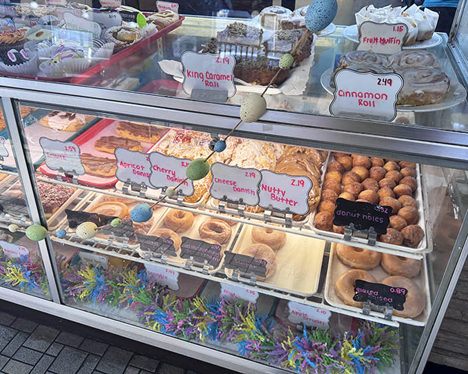 Behold the bakery case of dreams, where glazed donuts, cinnamon rolls, and pastries compete for your attention like delicious beauty pageant contestants.