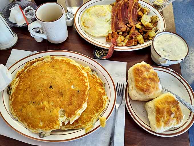 Pancake perfection! Golden discs of fluffy goodness alongside crispy bacon and eggs &ndash; breakfast doesn't get more honest than this.