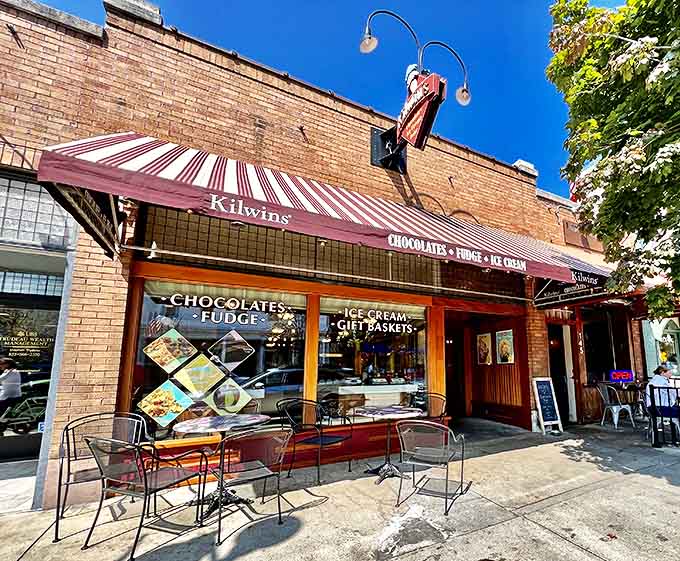 Kilwins stands as a sweet-tooth sanctuary, its striped awning practically a bullseye for anyone with chocolate cravings and childhood nostalgia.