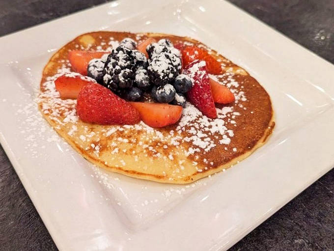 A perfect pancake exists, and it's here the Lemon Ricotta Hotcake topped with fresh berries and a dusting of powdered sugar.