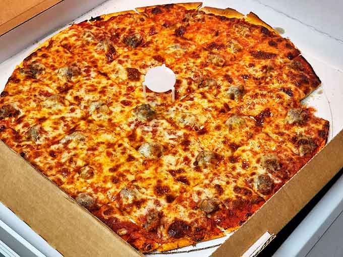 This isn't your average cheese and sausage pizza. The perfect balance of gooey cheese and savory meat sits atop a crust that achieves the holy grail: crispy outside, chewy inside.