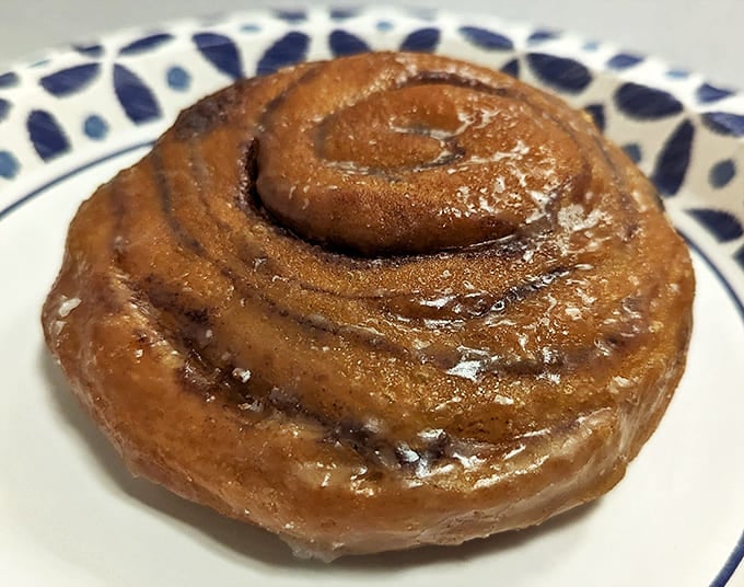 This cinnamon roll isn't just breakfast – it's an experience that makes you question why you'd ever eat anything else before noon.