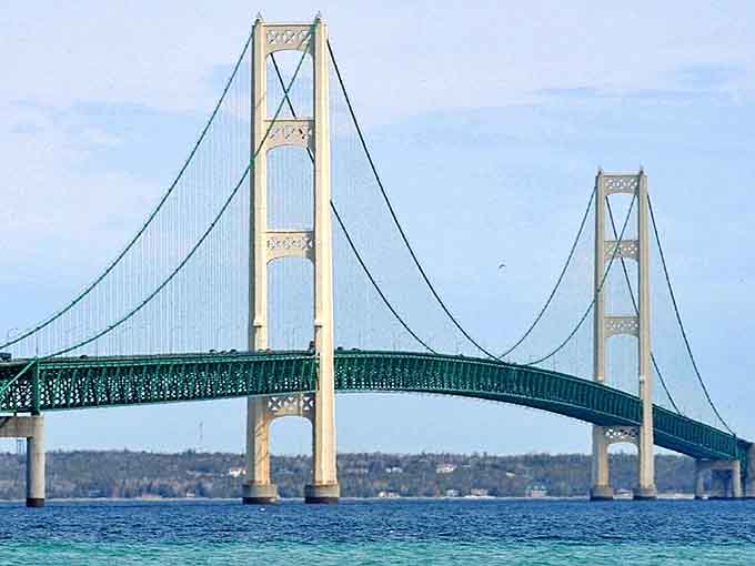 The mighty Mackinac Bridge connects Michigan's peninsulas, standing as an engineering marvel that makes even the most bridge-phobic travelers gasp in awe.