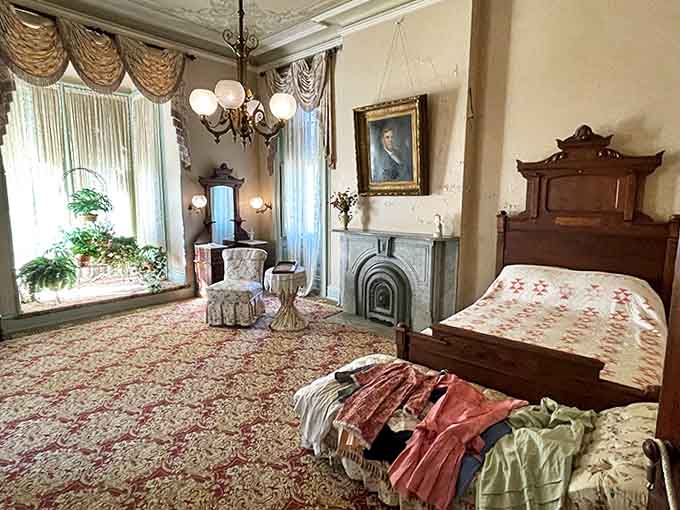 The master bedroom whispers tales of 19th-century luxury with its ornate furnishings, plush carpeting, and enough floral patterns to start a botanical garden.