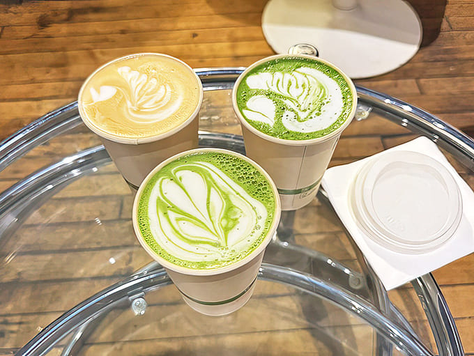 Artistry in every cup &ndash; these matcha and coffee lattes showcase the baristas' skill with delicate leaf patterns swirling atop silky foam.