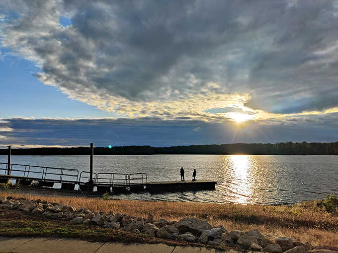 Visitors pause at the overlook, absorbing panoramic views that have remained largely unchanged since Native Americans first stood here.