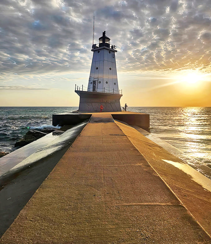 North Breakwater Light stands sentinel at pier's end, guiding ships and Instagram influencers to their respective destinations with equal importance.