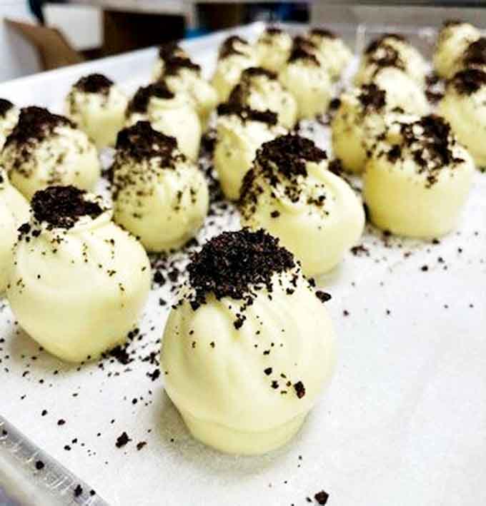 These aren't your average cookies and cream. Each truffle is hand-dipped in white chocolate and dusted with cookie crumbs.