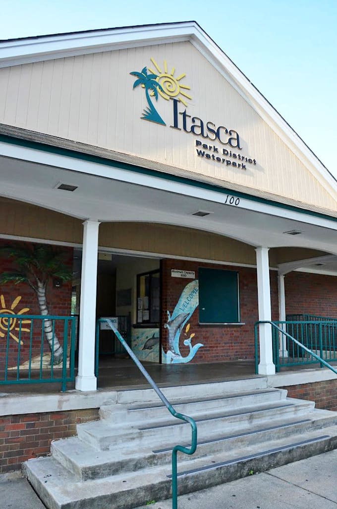 The Itasca Park District building welcomes visitors with its cheerful palm tree logo, a wink to the tropical fantasy within.