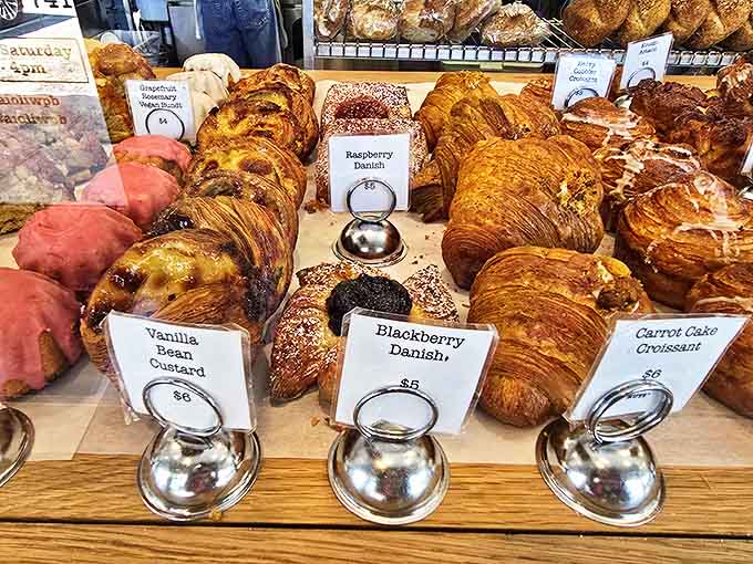 Raspberry danish, vanilla bean custard, blackberry beauty, this pastry case is basically edible art that happens to taste like heaven decided to open a bakery.