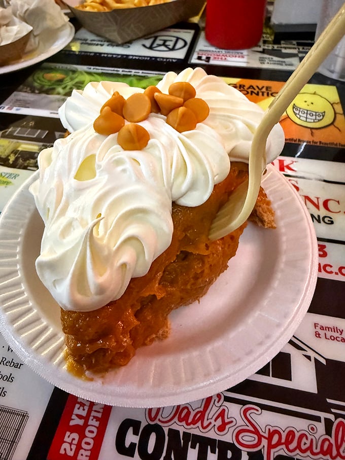 A mountain of whipped cream crowns the famous peanut pie, a regional specialty that's worth saving room for after that famous sandwich.
