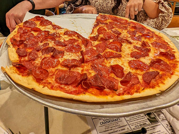 This pepperoni pizza isn't just food – it's architecture. Those perfectly curled pepperoni cups holding tiny pools of spiced oil are little flavor hot tubs.