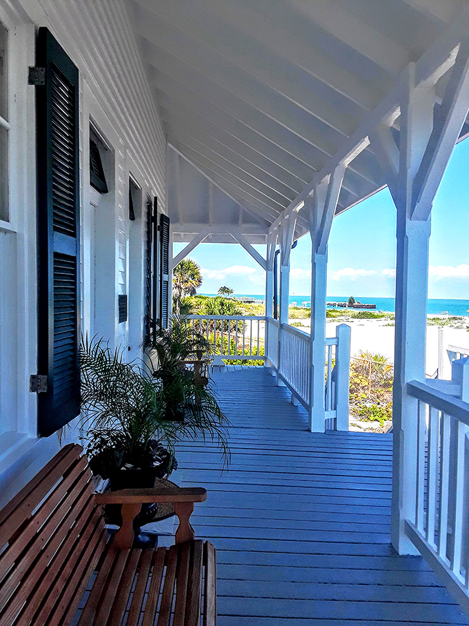 The wrap-around porch isn't just architectural eye candy—it's a front-row seat to one of Florida's most breathtaking coastal panoramas.