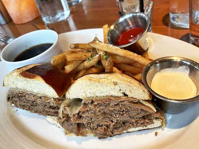The Prime Rib Dip sandwich &ndash; tender, thinly-sliced beef on a soft roll with savory au jus and perfectly crisp fries.