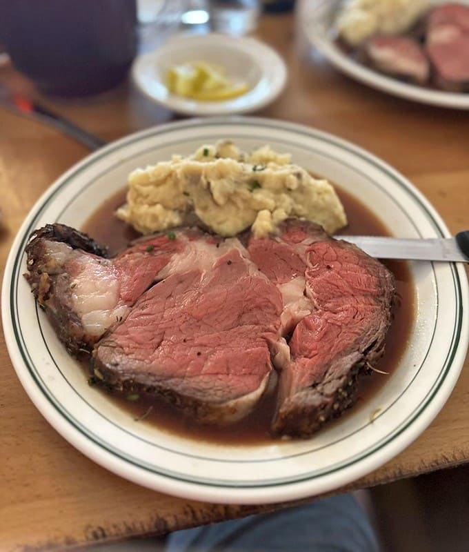 Prime rib so tender it practically surrenders to your knife, its perfectly pink interior promising flavor that lives up to its reputation.