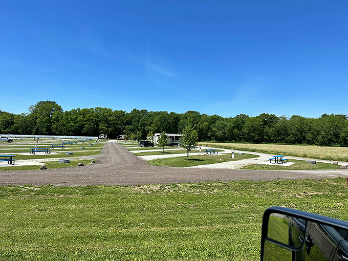 Neatly arranged camping spots stretch into the distance, each promising its own little slice of outdoor tranquility.