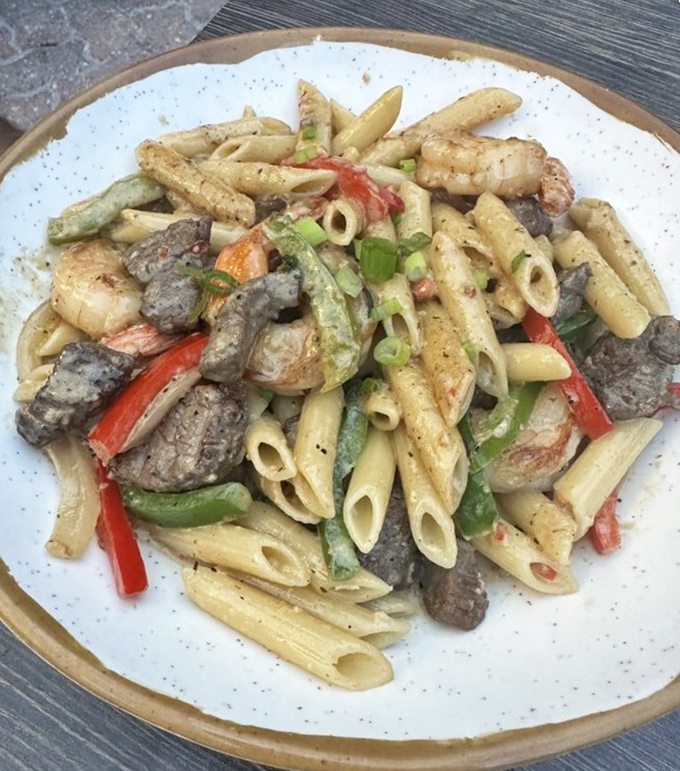 The Rasta Pasta brings together worlds of flavor &ndash; al dente penne dancing with tender beef and shrimp in a sauce that hits all the right notes.
