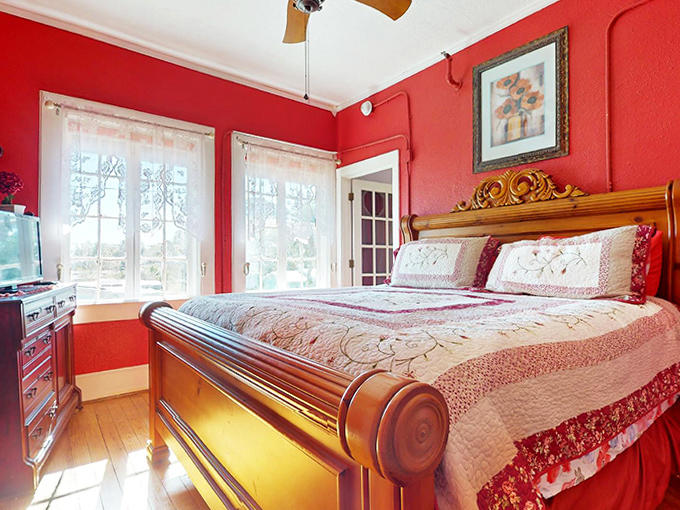 This crimson bedroom doesn't just make a statement; it delivers a passionate monologue that makes even checking emails feel romantic.