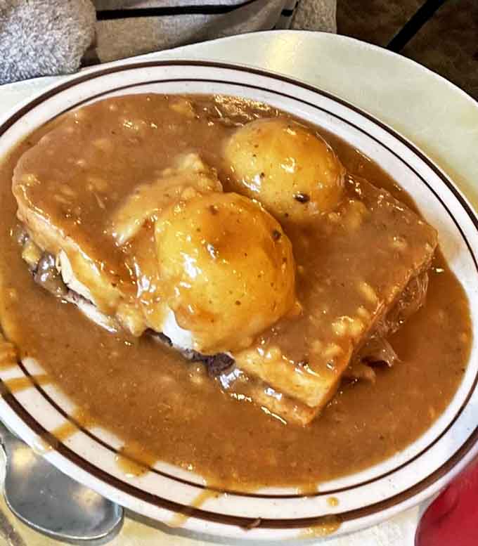 This isn't just a sandwich &ndash; it's a masterpiece of tender roast beef smothered in rich gravy that would make any Midwesterner misty-eyed with nostalgia.