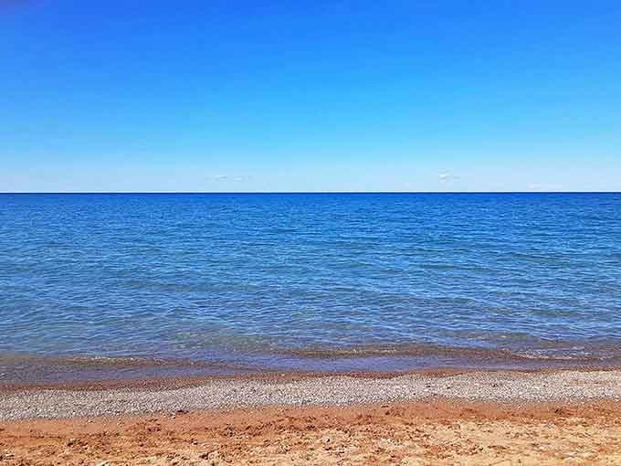 Lake Huron's waters shift between mesmerizing shades of blue, creating a natural light show that no filter could ever improve.