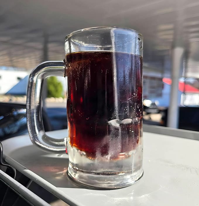 Liquid nostalgia in a frosty mug – Rudy's legendary root beer arrives with a perfect head of foam, each sip more refreshing than the last.