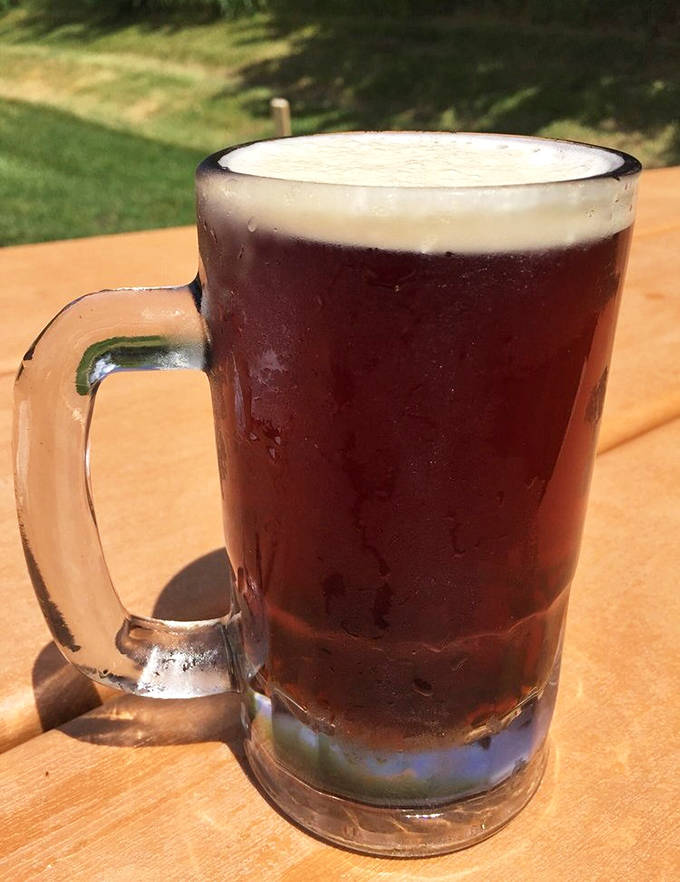 Dark, rich root beer in a proper glass mug &ndash; none of that plastic nonsense here. The condensation tells you it's cold enough to refresh on any summer day.