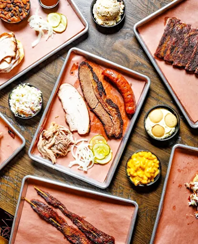 Barbecue nirvana on a tray: where smoke-kissed meats and homestyle sides create a symphony of flavors that'll haunt your dreams.