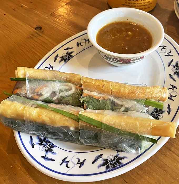 These aren't your average spring rolls. Translucent rice paper reveals fresh herbs and vegetables, paired with a dipping sauce that packs a punch.