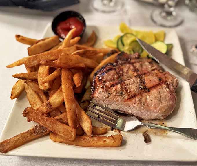 This isn't just steak and fries &ndash; it's a masterclass in simplicity. Perfectly seared beef alongside golden, crispy potatoes that snap between your teeth.
