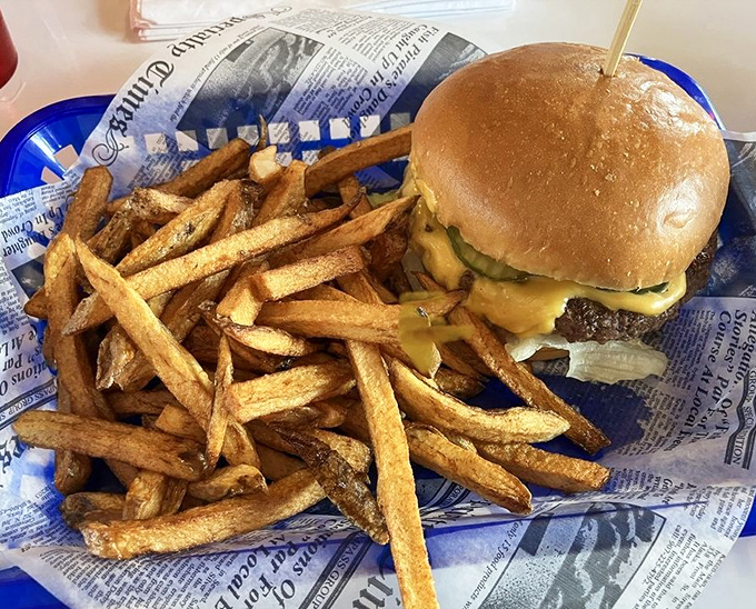 Stacked high and ready to eat! Our juicy steak burger and crispy fries are a classic American lunch that hits the spot.
