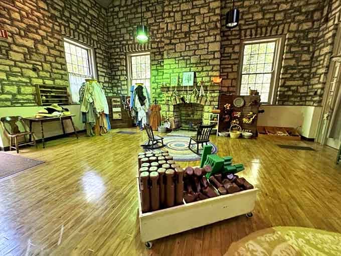 The Stone Barn Gift Shop interior blends historical atmosphere with modern conveniences, offering souvenirs without breaking the time-travel illusion.