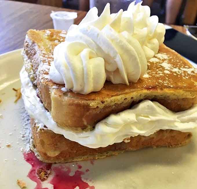 This stuffed French toast isn't just breakfast – it's an experience. Cream-filled perfection topped with whipped cream that makes mornings worth facing.