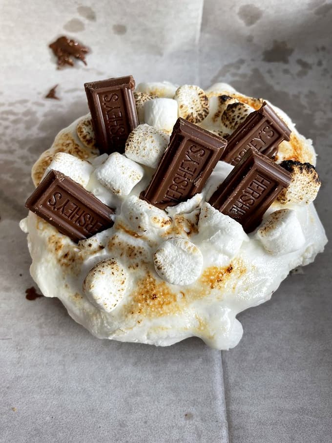 This isn't just a s'mores cookie &ndash; it's a campfire in edible form, with toasted marshmallows and Hershey's squares creating melty magic.