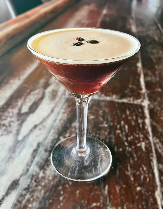The espresso martini arrives like a well-crafted sonnet &ndash; dark, rich, and topped with coffee beans that dance like perfectly placed punctuation.